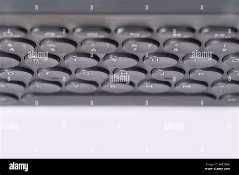 Close Up Of Black Retro Style Circular Keyboard With Round Keys And