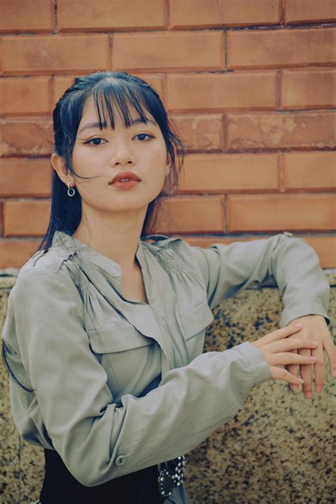 Girl In Gray Button Up Long Sleeve Shirt Sitting On Brown Dried Leaves Photo Free Girl Image