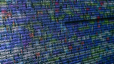 Digital Data Flow In A Futuristic Cityscape At Night Featuring Vibrant Binary Code Streams And