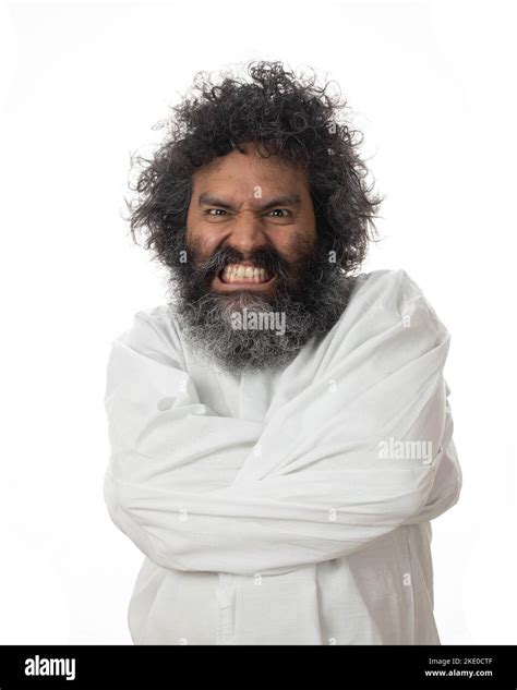 A Vertical Shot Of A Mental Man Going Crazy With Rage In A Straitjacket