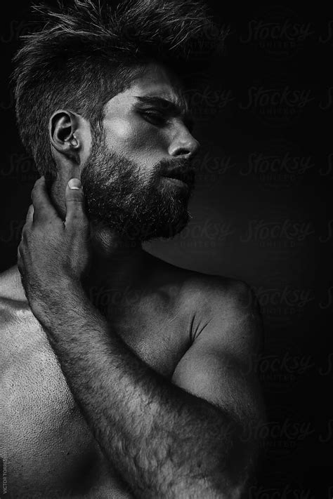 Muscular Shirtless Man In Dark Background By Stocksy Contributor