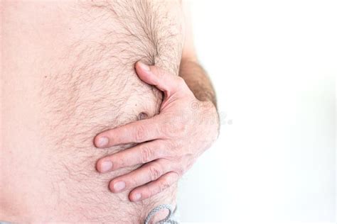 Caucasian Male Hand Grabbing Naked Hairy Belly Fat Close Up Isolated