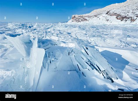 Landscape Of Lake Baikal Frozen In Early Spring With Ice Shelves And
