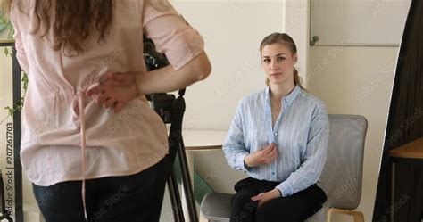 Woman Posing Undressing In Front Of Camera On Casting Beautiful Female In Unbuttoned Shirt