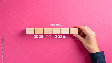 Loading Transition From 2025 To 2026 With Wooden Blocks On Vibrant Pink Background Stock