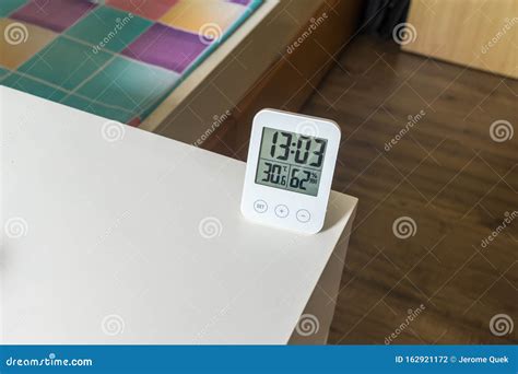 Indoor Electronic LCD Digital Clock With Humidity Temperature Sensor Display Device Stock Photo