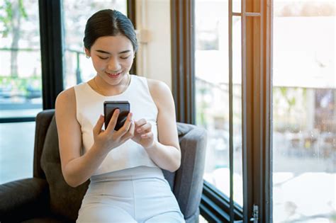 Young Business Woman Speaking With Mobile Phone In The Office Stock