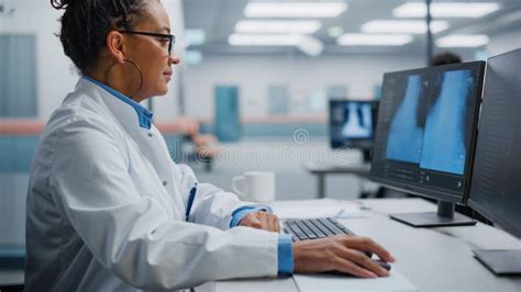 Hospital Laboratory Black Female Medical Doctor Is Working On Computer