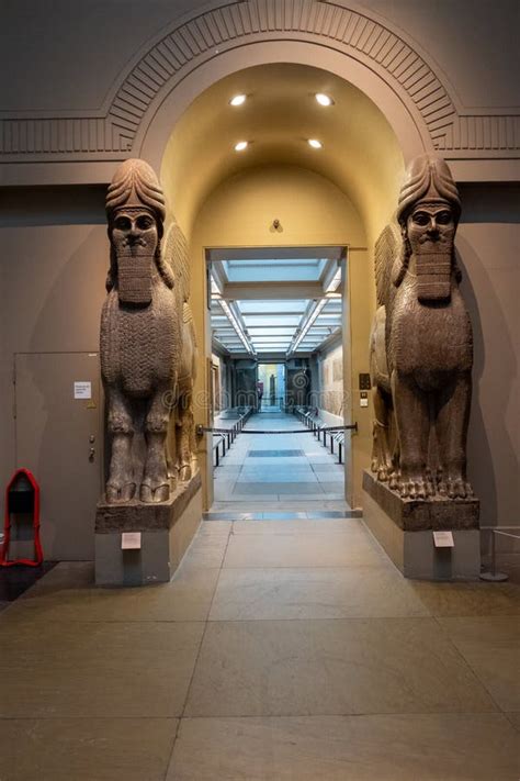 Ancient Assyrian Lamassu Statues Flank A Museum Entrance British