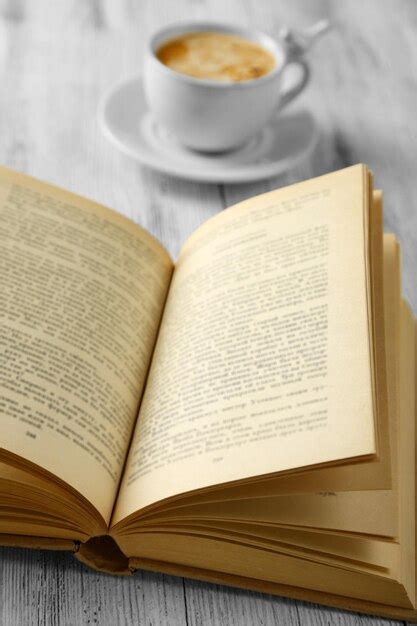 Premium Photo Still Life With Cup Of Coffee And Book Close Up