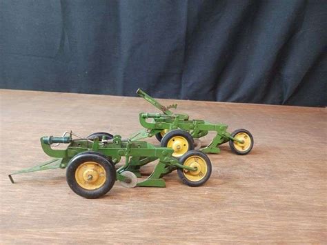 2 116 John Deere Plows Aumann Auctions Inc
