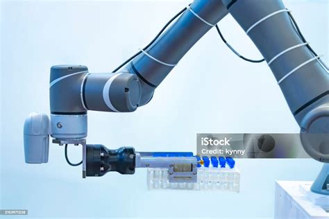 Robot Arm With Test Tube For Biological Experiments In Laboratory Stock