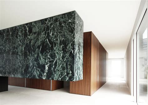 Monolithic Marble Partition Divides Antwerp Penthouse