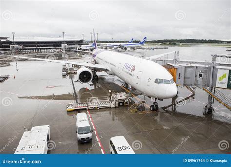 Loading A Passenger Plane On The Airport Tarmac With The Passengers Loading A Passenger Plane On The Airport Tarmac With The Passengers