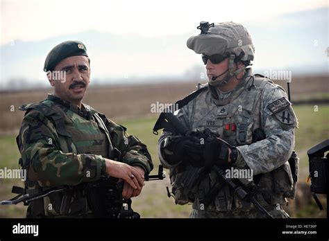 Staff Sgt Nicholas Ives And Capt Mohammad Ali Yazdani Discuss The