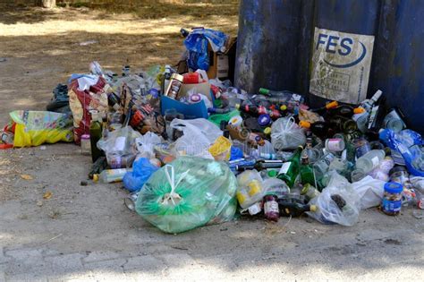 Lot Of Garbage On Sidewalk In Park On City Street Garbage Dump After