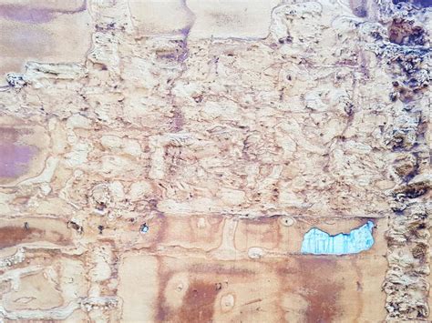 Close Up Of A Weathered Wall Showcasing An Array Of Textures And Colors The Surface Displays