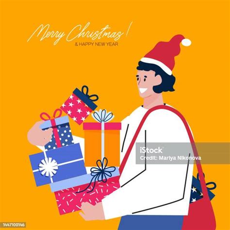 크리스마스 모자를 쓰고 손에 선물을 들고 미소에 놀란 행복해 보이는 잘생긴 남자 메리 크리스마스와 새해 복 많이 받으세요 디자인 선물 상자 활 겨울 방학 크리스마스 인사말