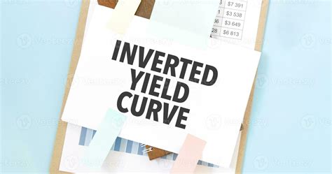 Paper Plate With Text Take Inverted Yield Curve Diagram Notepad And Blue Background 25073935