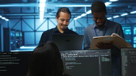 Man Inspecting Server Hub Infrastructure Reading Paperwork From Folder