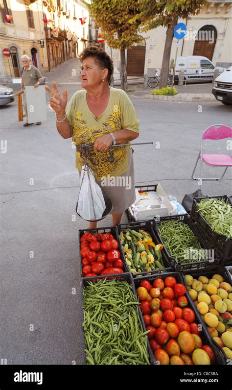 A Lady Selling Fruit And Vegetables At The Street Market In Sulmona