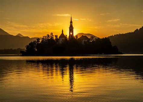 Sun Bursting Through The Church At Lake Bled Slovenia Buy Fine Art Prints