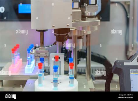 Automated System Designed For Handling Test Tubes In A Laboratory Setting Showcasing The