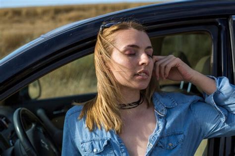 Premium Photo Woman With Eyes Closed Sitting In Car