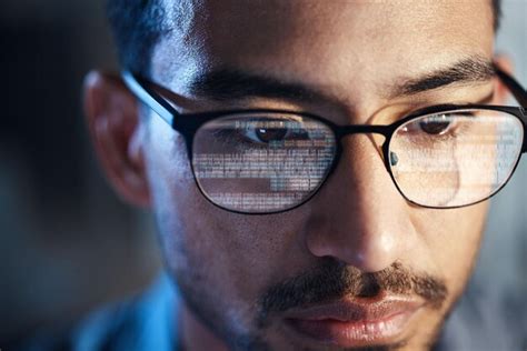 premium photo glasses man and reflection of code on computer working