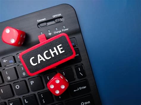 Premium Photo Keyboard And Red Dice With The Word Cache Business Concept