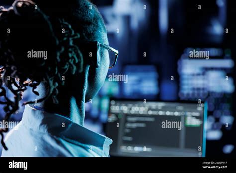 trained admin running code and programming on laptop troubleshooting