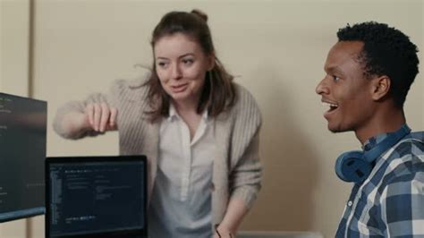 System Engineers Celebrating Successful Code Compiling Doing High Five