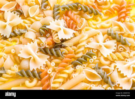 Different Types Of Raw Pasta As Background Closeup Stock Photo Alamy