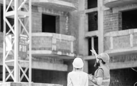 Premium Photo Woman Engineer And Builder Communicate At Construction Site Relationships