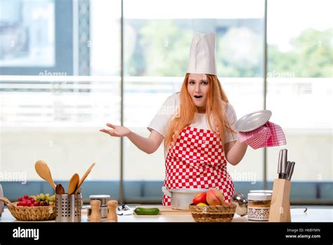 Redhead Cook Working In The Kitchen Stock Photo Alamy
