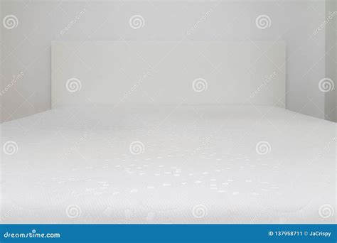 Close Up Of Memory Foam Mattress On The Bed Frame At Sleeping Room