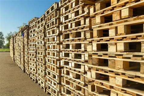 Premium Photo Stacks Of Wooden Pallets In A Warehouse Yard Of Factory