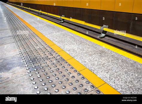 diagonal tactile paving at platform edge also called detectable warning