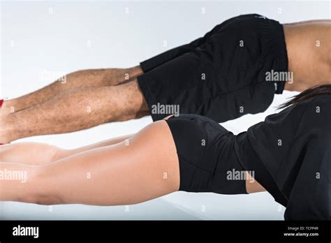 Partial View Of Man And Woman Doing Push Ups On White Background Stock Photo Alamy