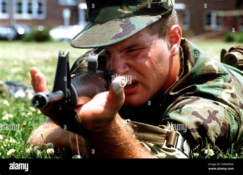 A Recruit Aims His M16a1 Rifle From A Prone Position During Small Arms