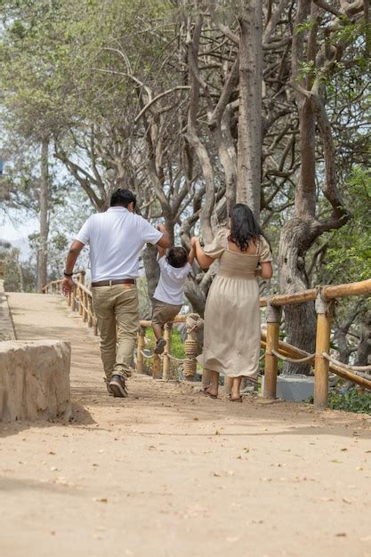 Premium Photo A Man And Woman Are Walking Down A Path With A Man And Woman