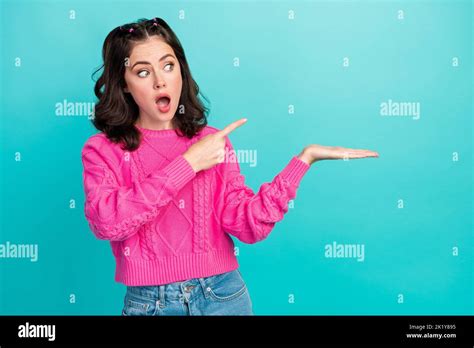 Portrait Photo Of Young Attractive Pretty Woman Funny Look Directing Finger Hold Hand Empty