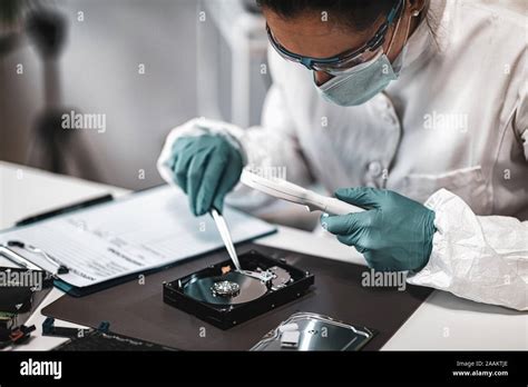 forensic science data forensic analyst examining computer hard drive