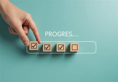 Hand Placing Check Mark On Wooden Cube For Progress Concept Stock