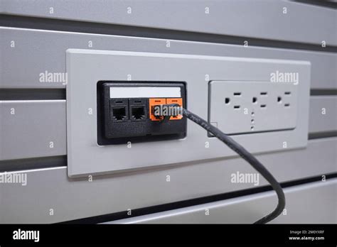 Ethernet Cable Plugged Into Wall Socket 4 Socks Two Black Two Orange Cable Plugged One Stock