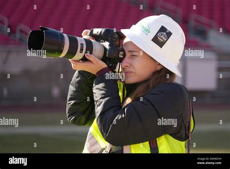 Female Press Photographer Meg Oliphant Takes Photos Wearing A Hard Hat During 2023 Busch Light