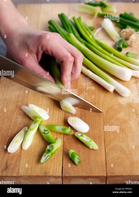 Chopping Spring Onions Stock Photo Alamy