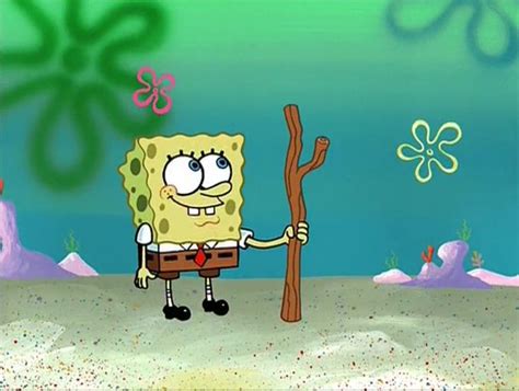 The Spongebob Is Holding A Stick In His Hand