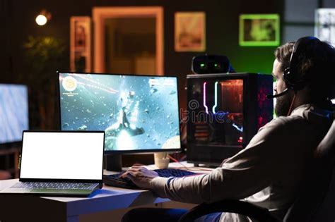 Mockup Notebook Device Next To Gamer Using Powerful Pc Stock Image