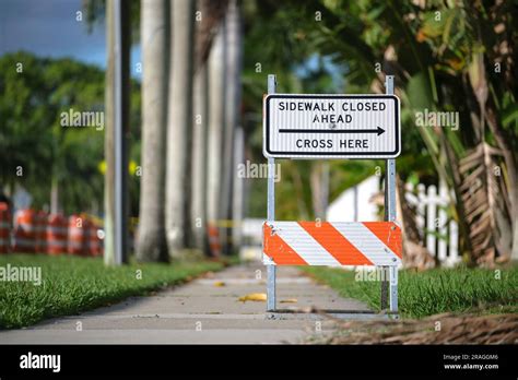 Warning Sign That Sidewalk Is Closed At Street Construction Site